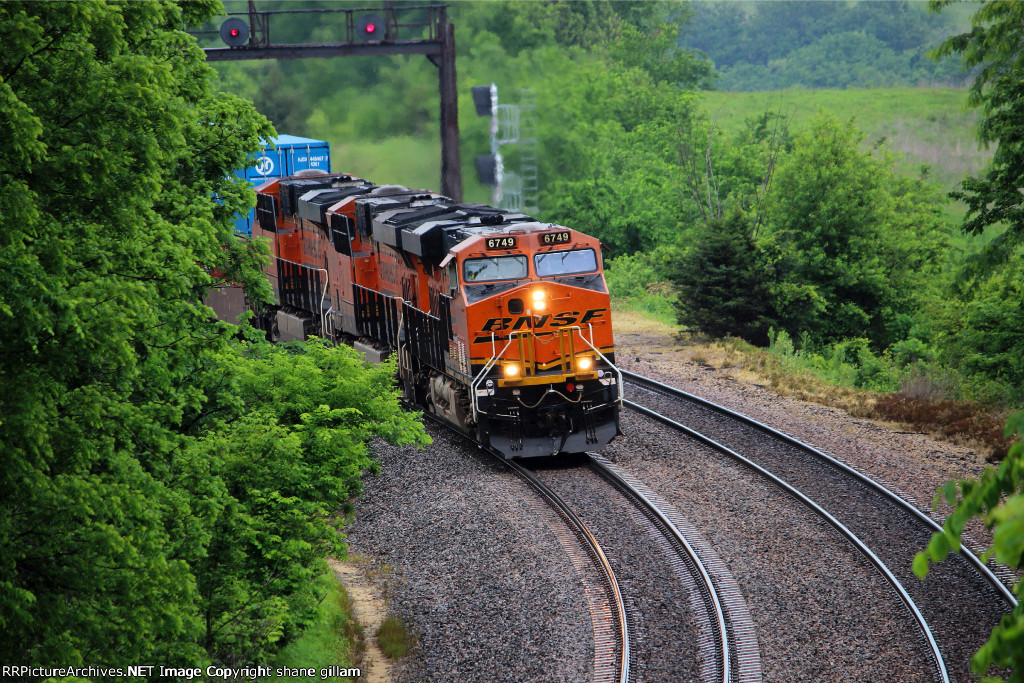 BNSF 6749 leads this wb stack train around the curves.